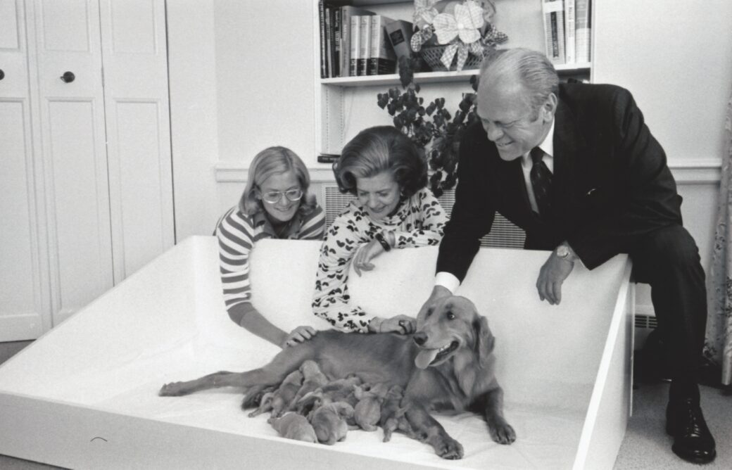 President and Mrs. Gerald Ford and daughter Susan pet their golden ...