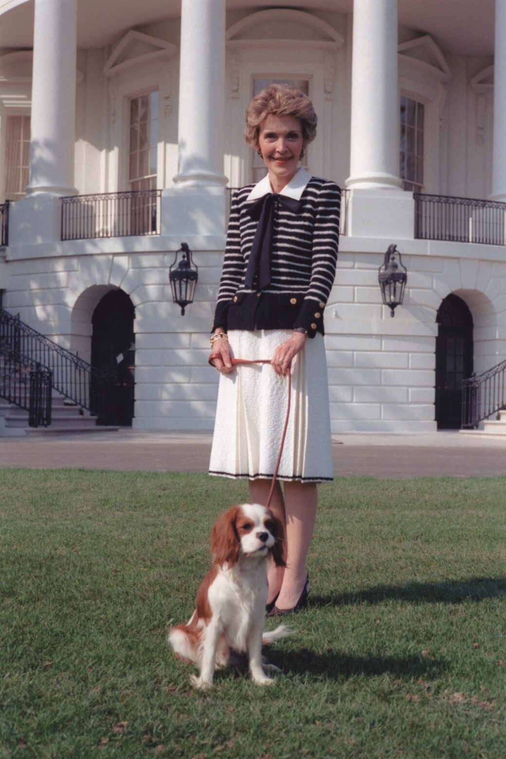 Nancy Reagan stands with Rex on the south lawn, 1986. - White House ...